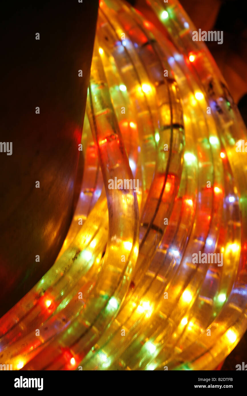 tree covered with bright tube lights at night Stock Photo - Alamy