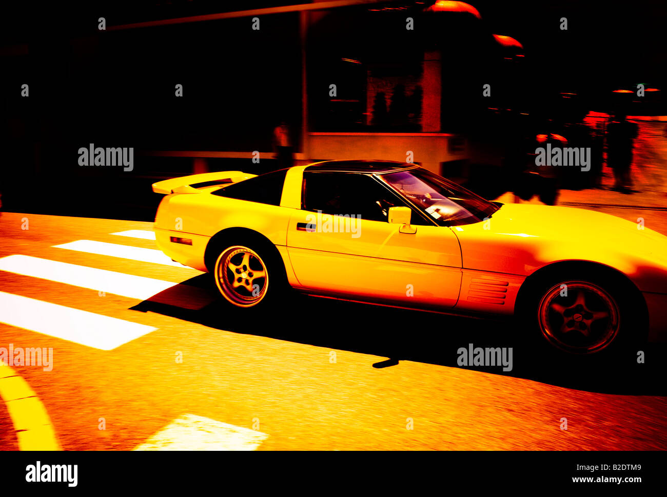 Sports car drive by Stock Photo - Alamy