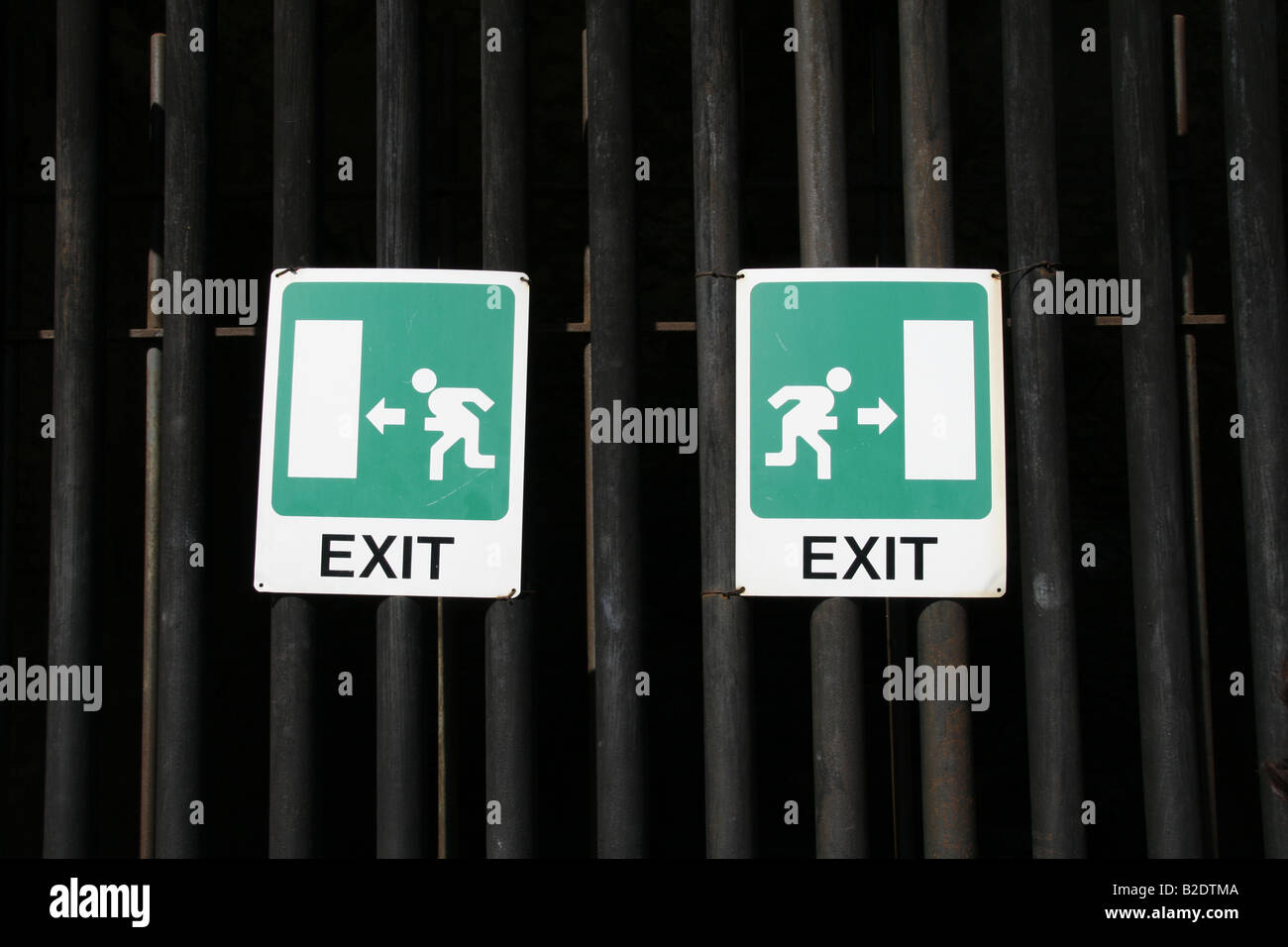 two emergency exit signs outdoors Stock Photo - Alamy