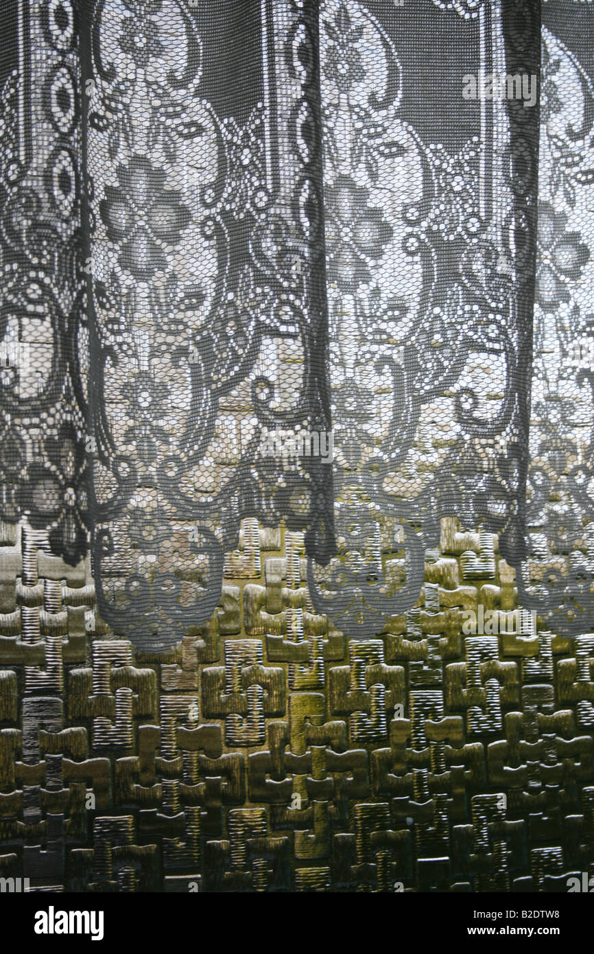 pattern glass window with lace net curtains Stock Photo - Alamy