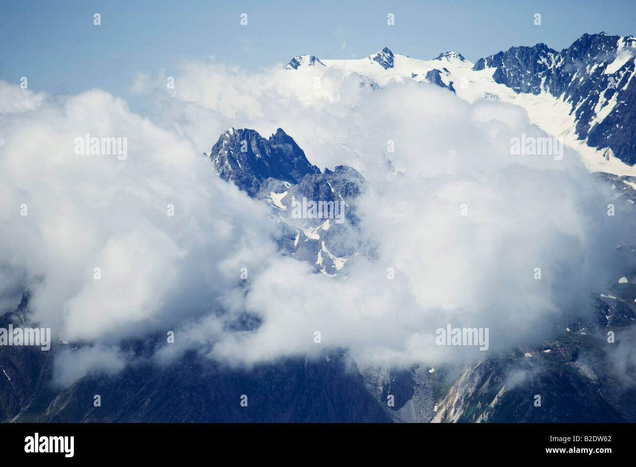 alpine mountain summits and cloud Stock Photo - Alamy
