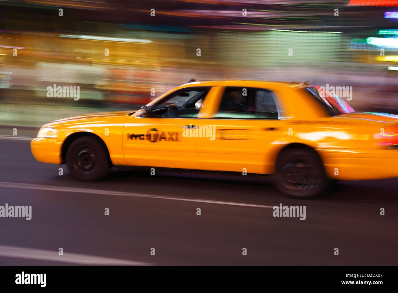Yellow taxi cab at night with motion blur - New York City, USA Stock ...