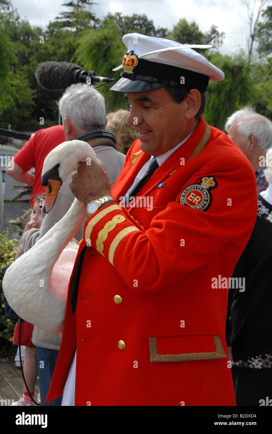The Queen's Swan Marker, David Barber returns a swan to the river ...