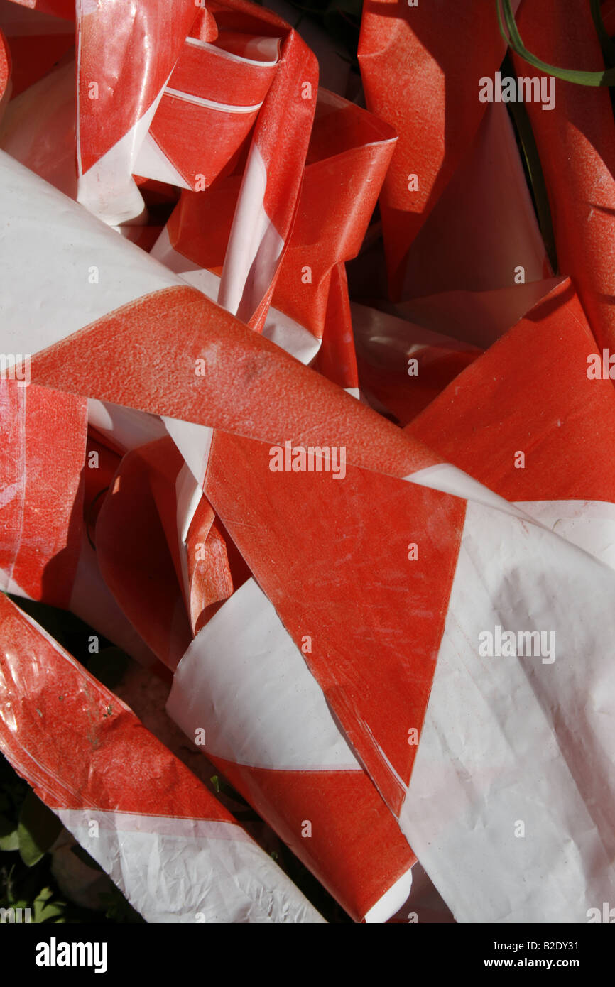 close up of red white plastic tape barrier cordon Stock Photo - Alamy
