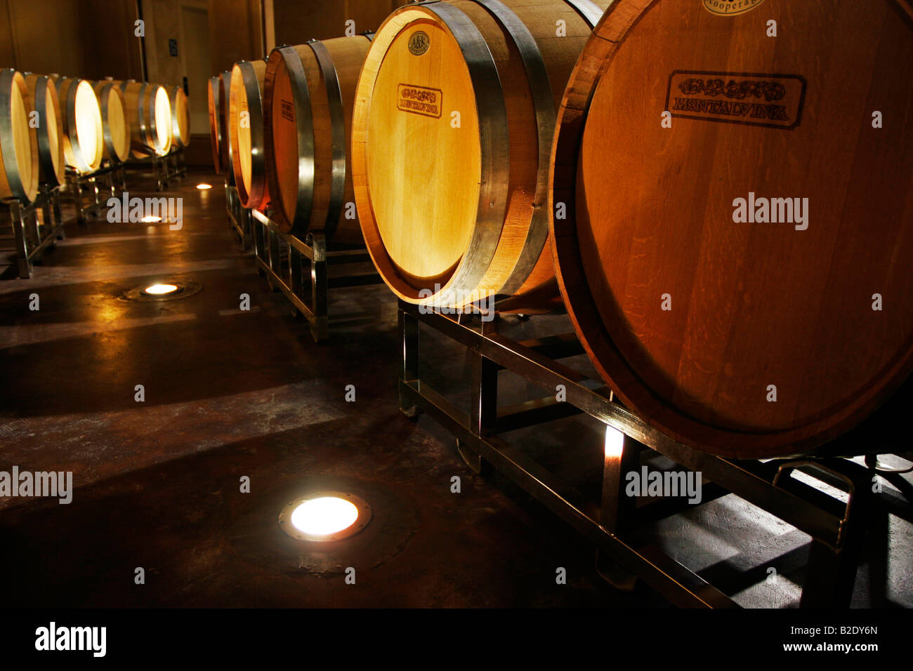 Warm light on wine casks Stock Photo - Alamy