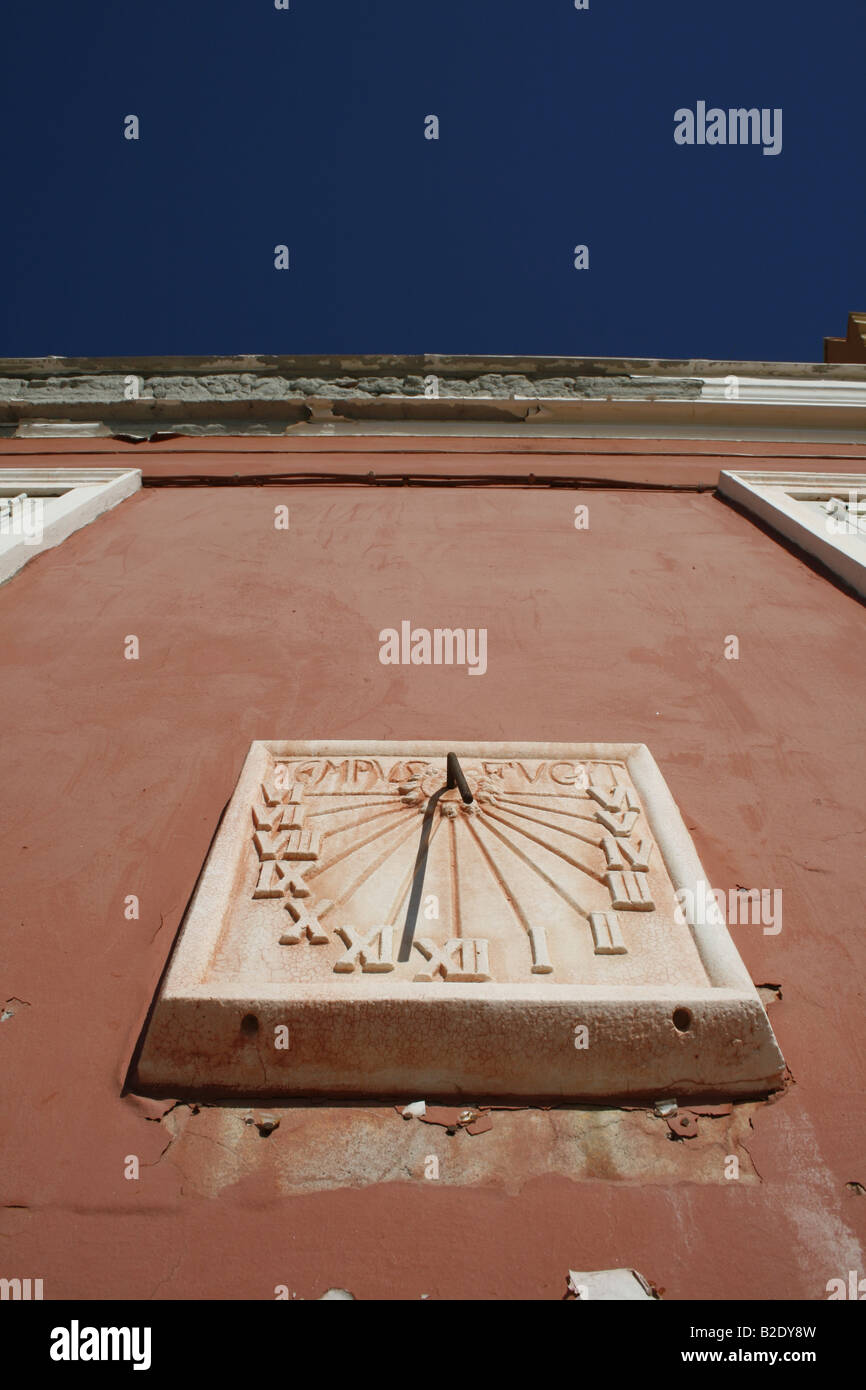 sun dial on wall in italy Stock Photo - Alamy