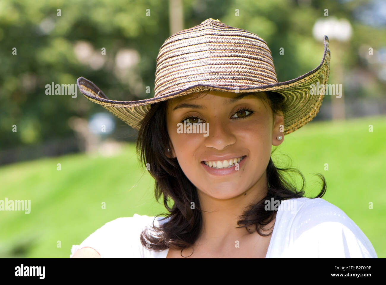 The beautiful Colombian girl in a hat Stock Photo - Alamy