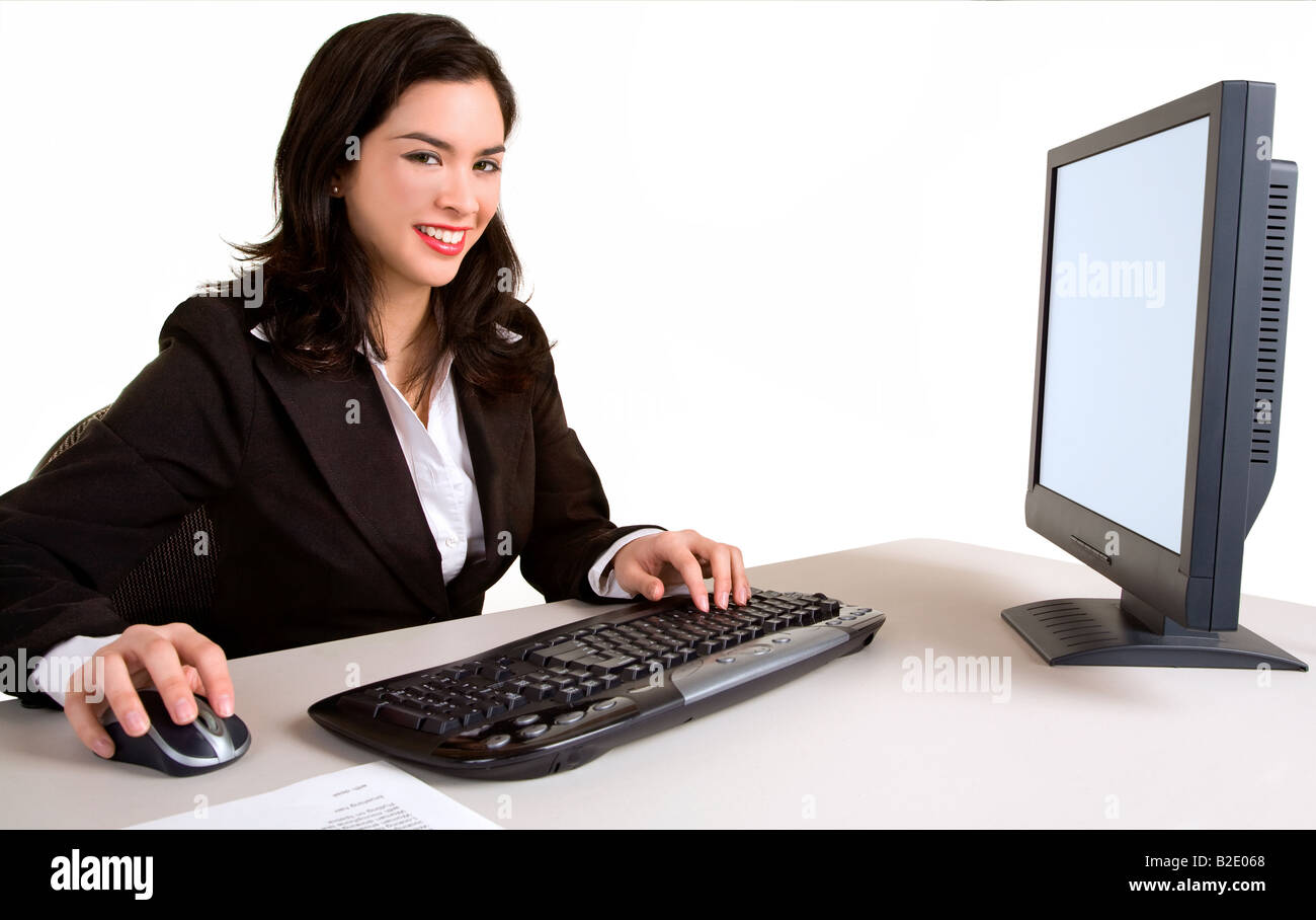 A smiling business woman is working at her computer Stock Photo - Alamy