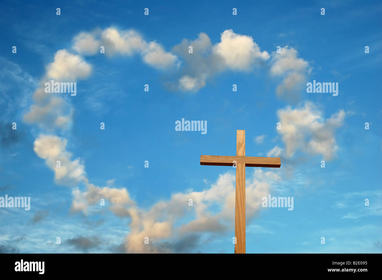 Wooden cross and heart shaped clouds in the background Stock Photo - Alamy