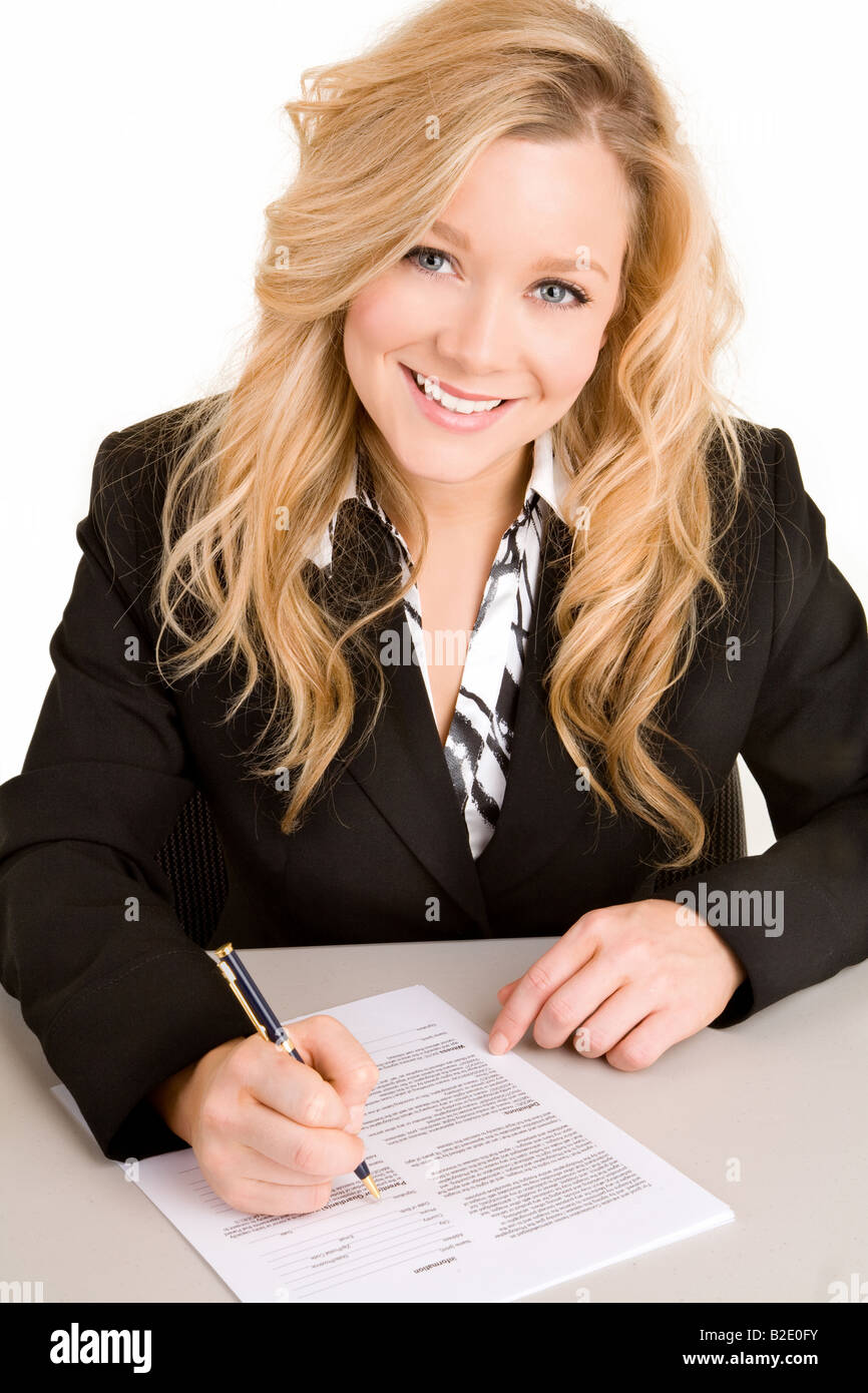 Girl signing document sitting hi-res stock photography and images - Alamy