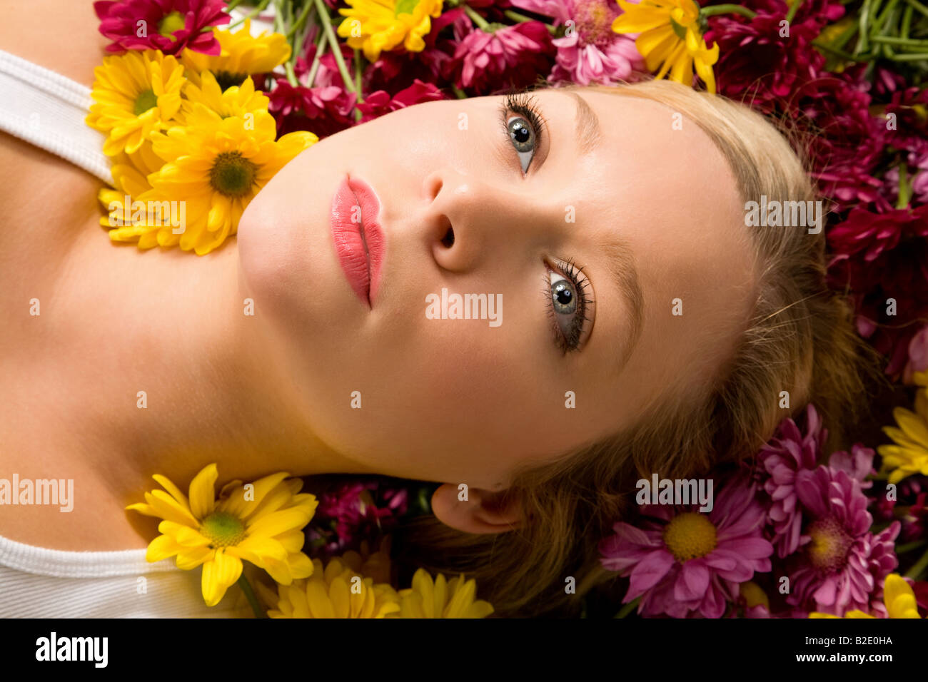 Beautiful woman laying down flowers hi-res stock photography and images ...