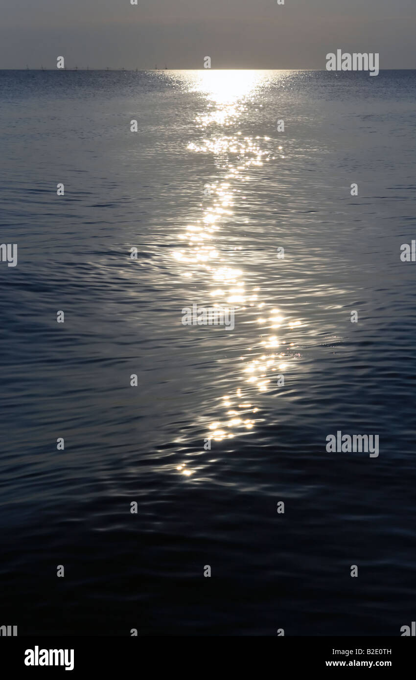Moonlight path on night sea water surface Stock Photo - Alamy