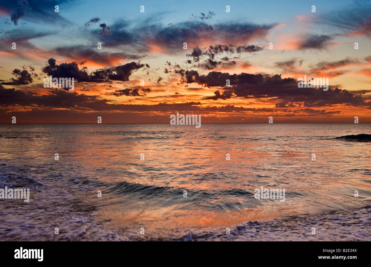 Sunset over the ocean Stock Photo - Alamy