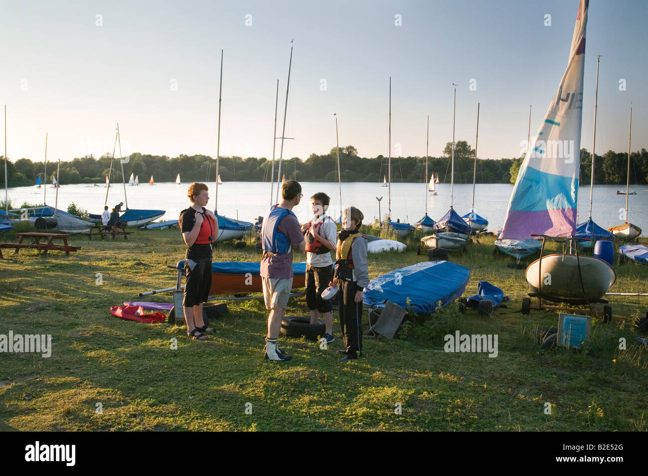 The sailing school instructor gives advice to children before sailing ...