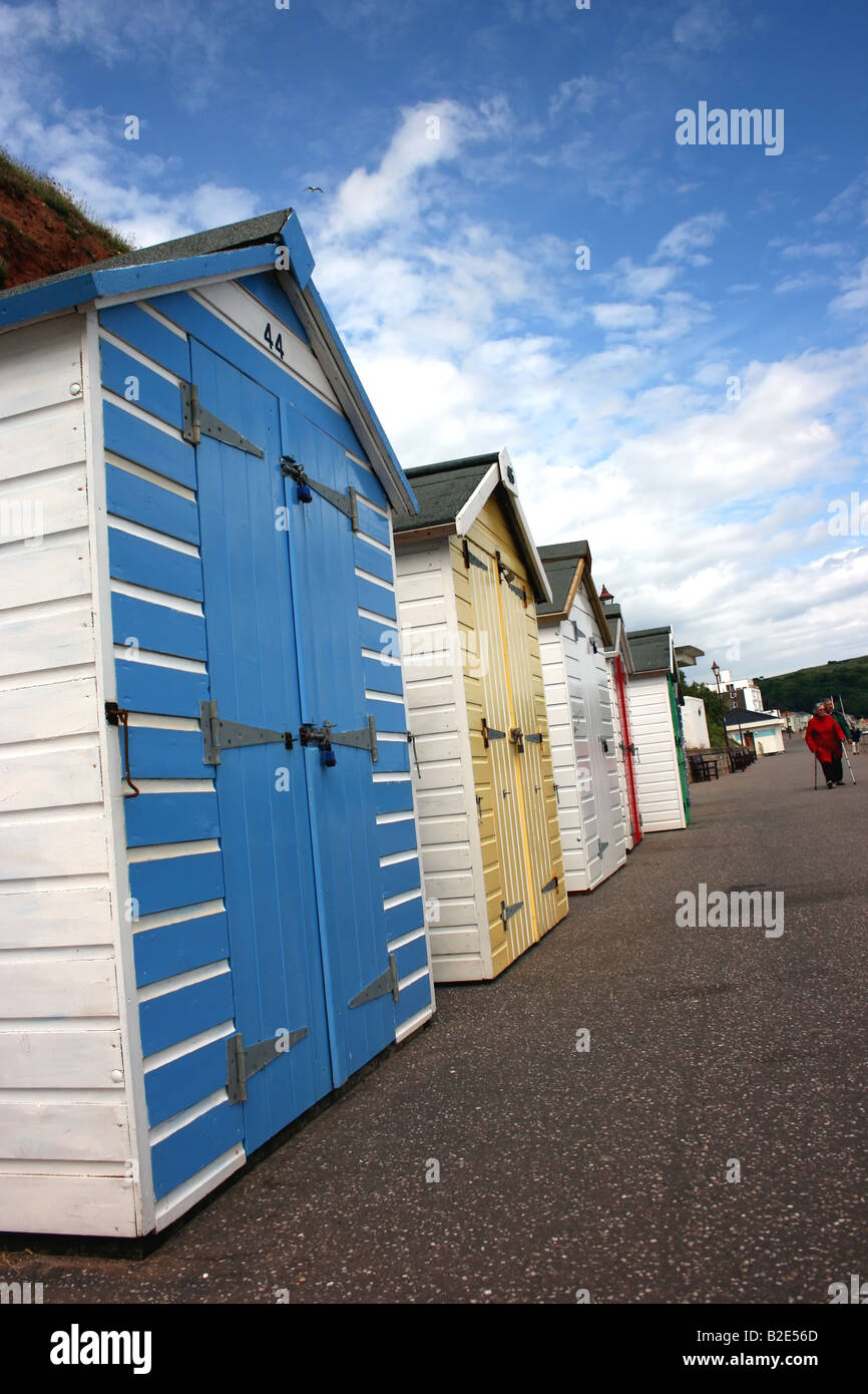 Row of colourful beach huts on the promenade at Seaton, Devon, England ...