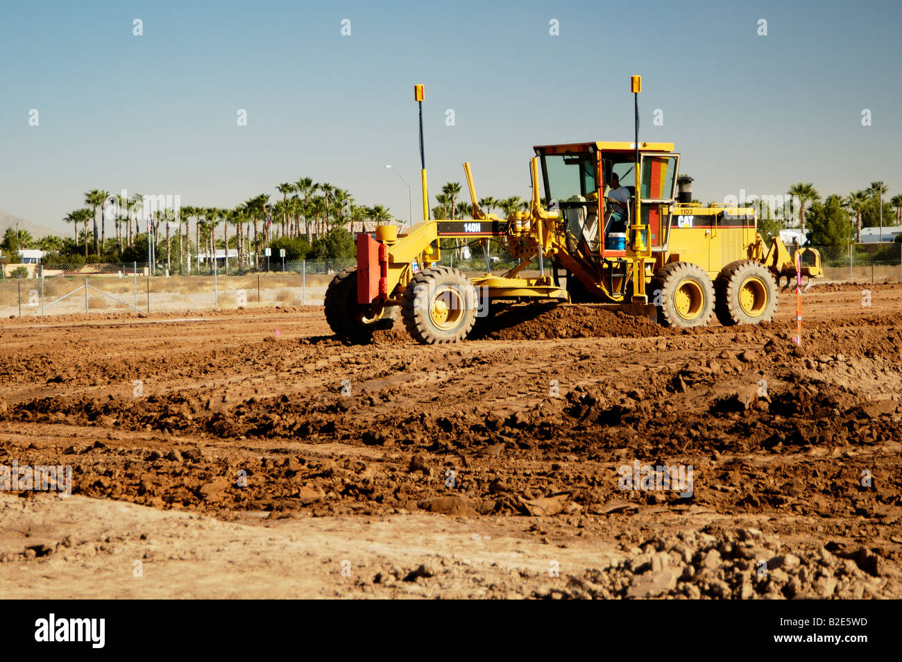Heavy construction equipment at work on a commercial construction site ...
