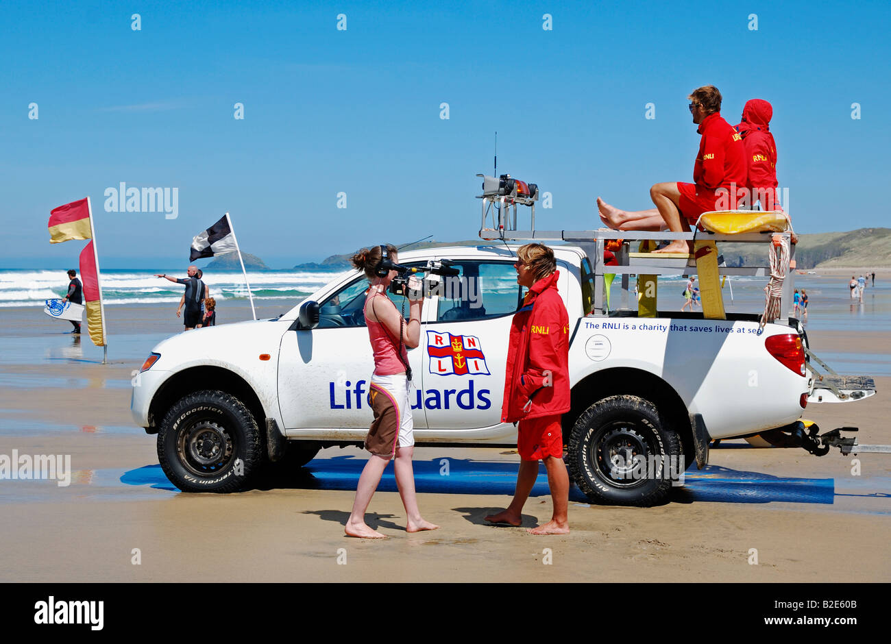 R.N.L.I. lifeguard at perranporth,cornwall,uk, being interviewed and ...