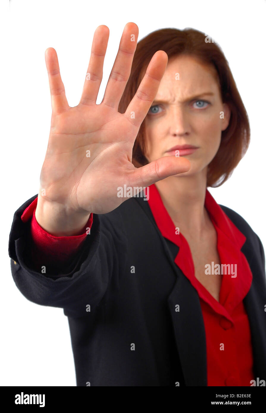 Young woman showing hand to stop unwanted action Stock Photo - Alamy