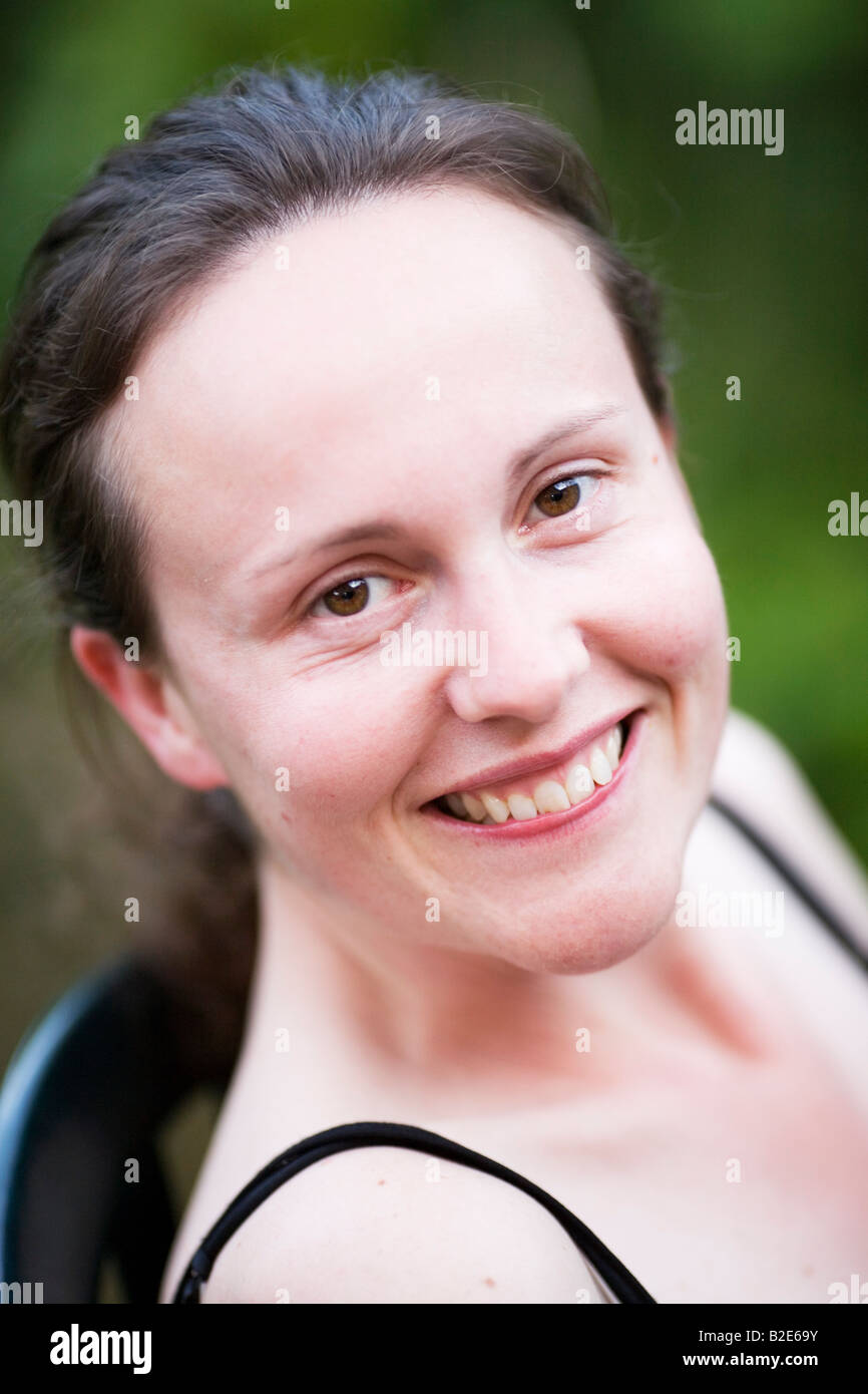 Smiling female headshot Stock Photo - Alamy