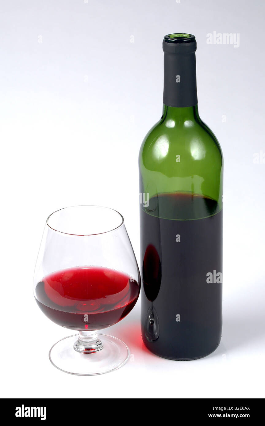 Bottle of red wine and glass over a light background Stock Photo - Alamy