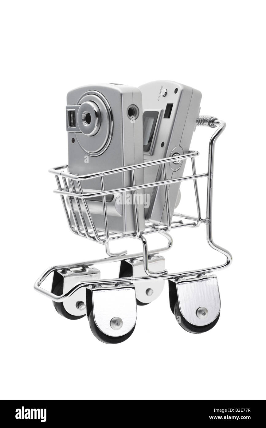 Digital cameras in mini push cart on white background Stock Photo - Alamy