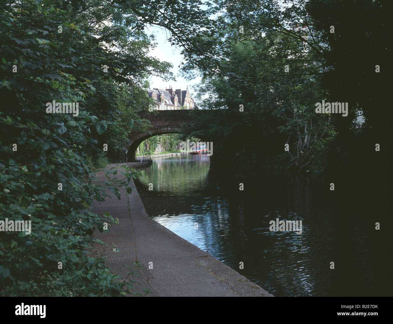 Trees beside the towpath of the Regent Canal in North London Stock ...