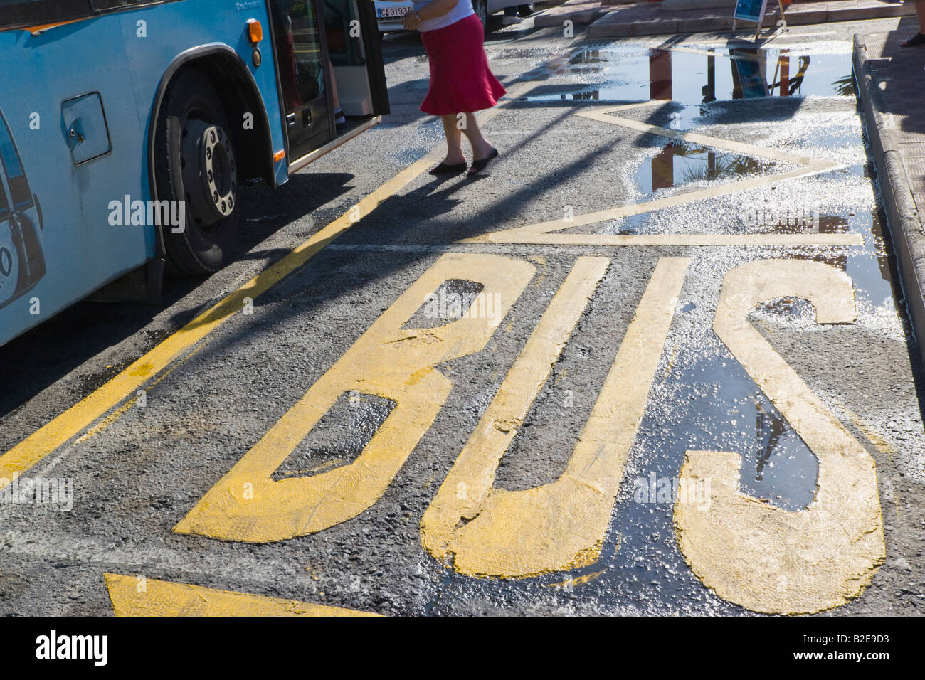 Boarding bus at bus stop Stock Photo - Alamy