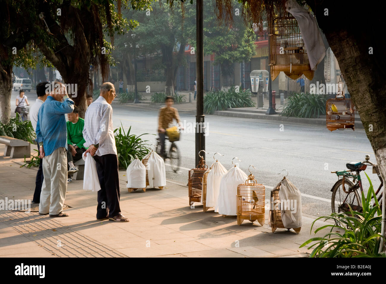 People standing at roadside Guangzhou Guangdong Province China Stock ...