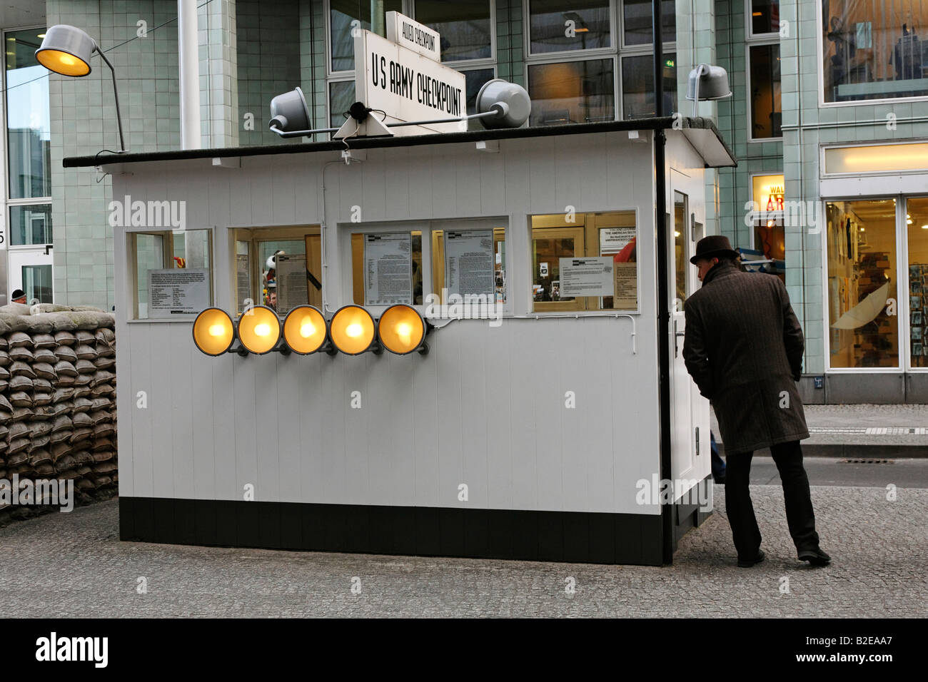 Rear view of man standing at checkpoint, Checkpoint Charlie, Berlin ...