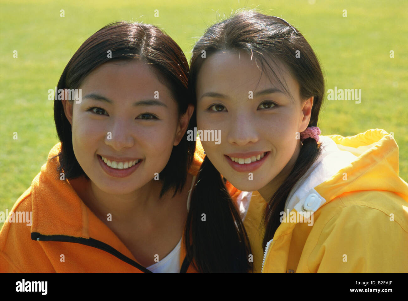 Portrait of two young Asian women Stock Photo - Alamy