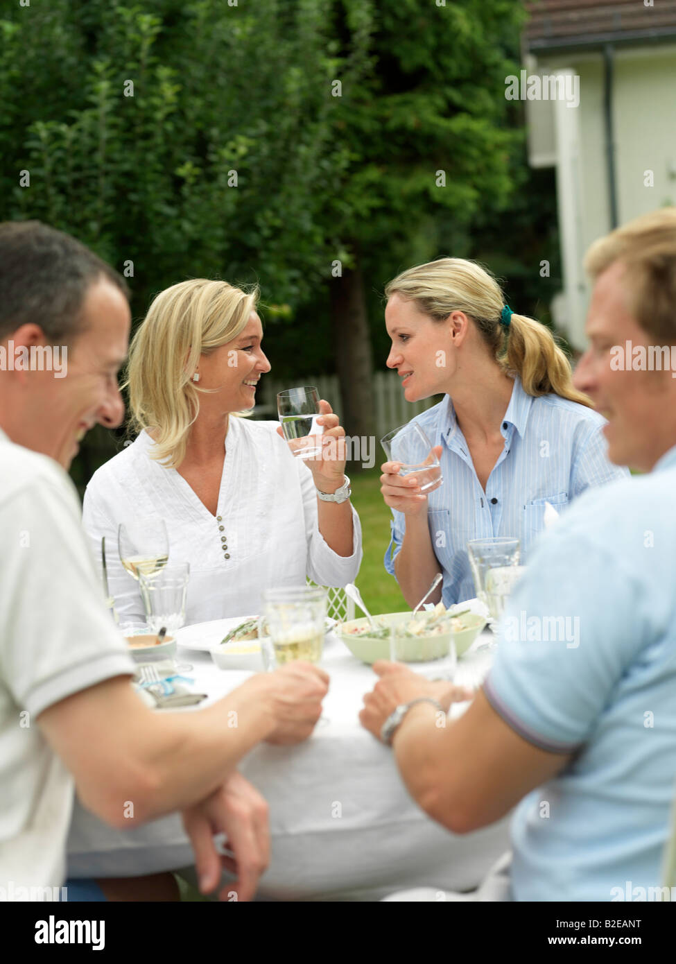 Two seated at table hi-res stock photography and images - Alamy