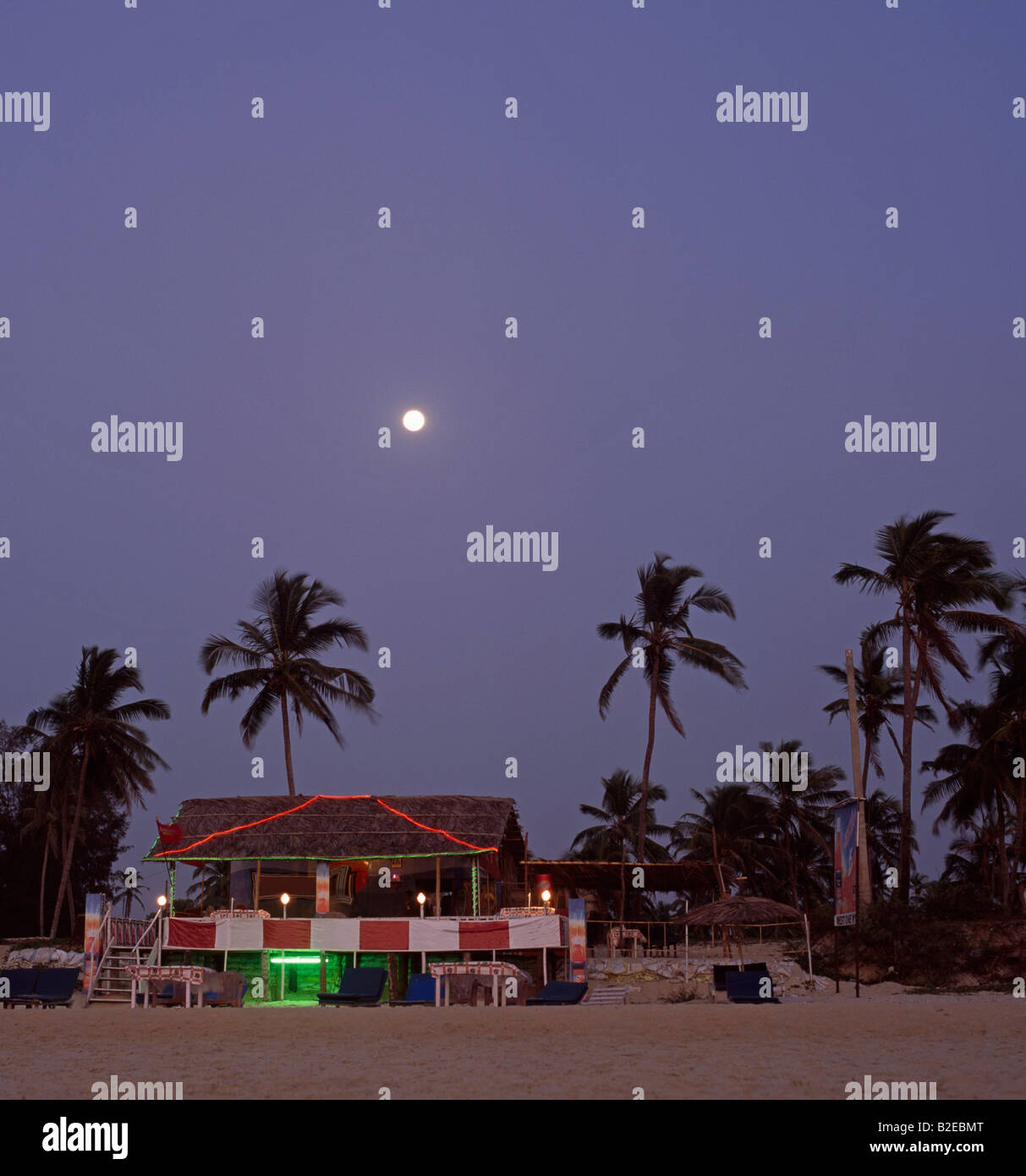 Beach cottage lit up at dusk, India Stock Photo - Alamy