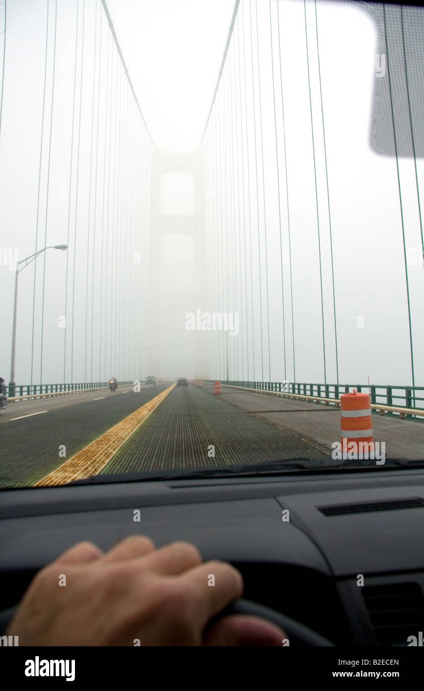 View from the inside of a car crossing the Mackinac Bridge on a foggy ...