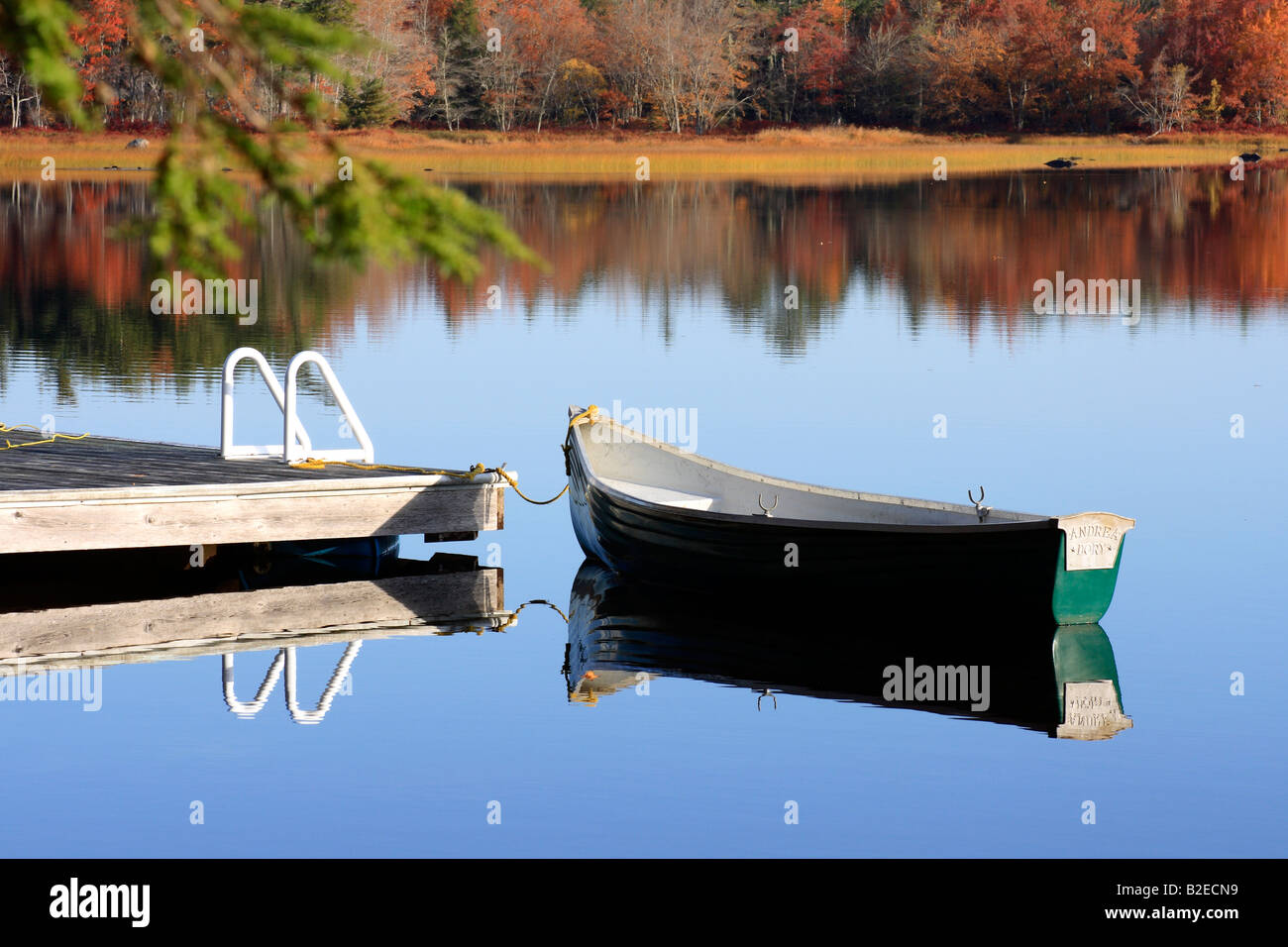 an autumn scenic with a wharf and rowboat at Ponhook Lake in nova ...