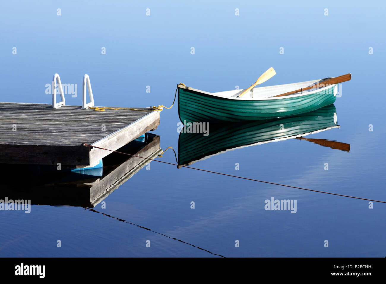 an autumn scenic with a wharf and rowboat at Ponhook Lake in nova ...