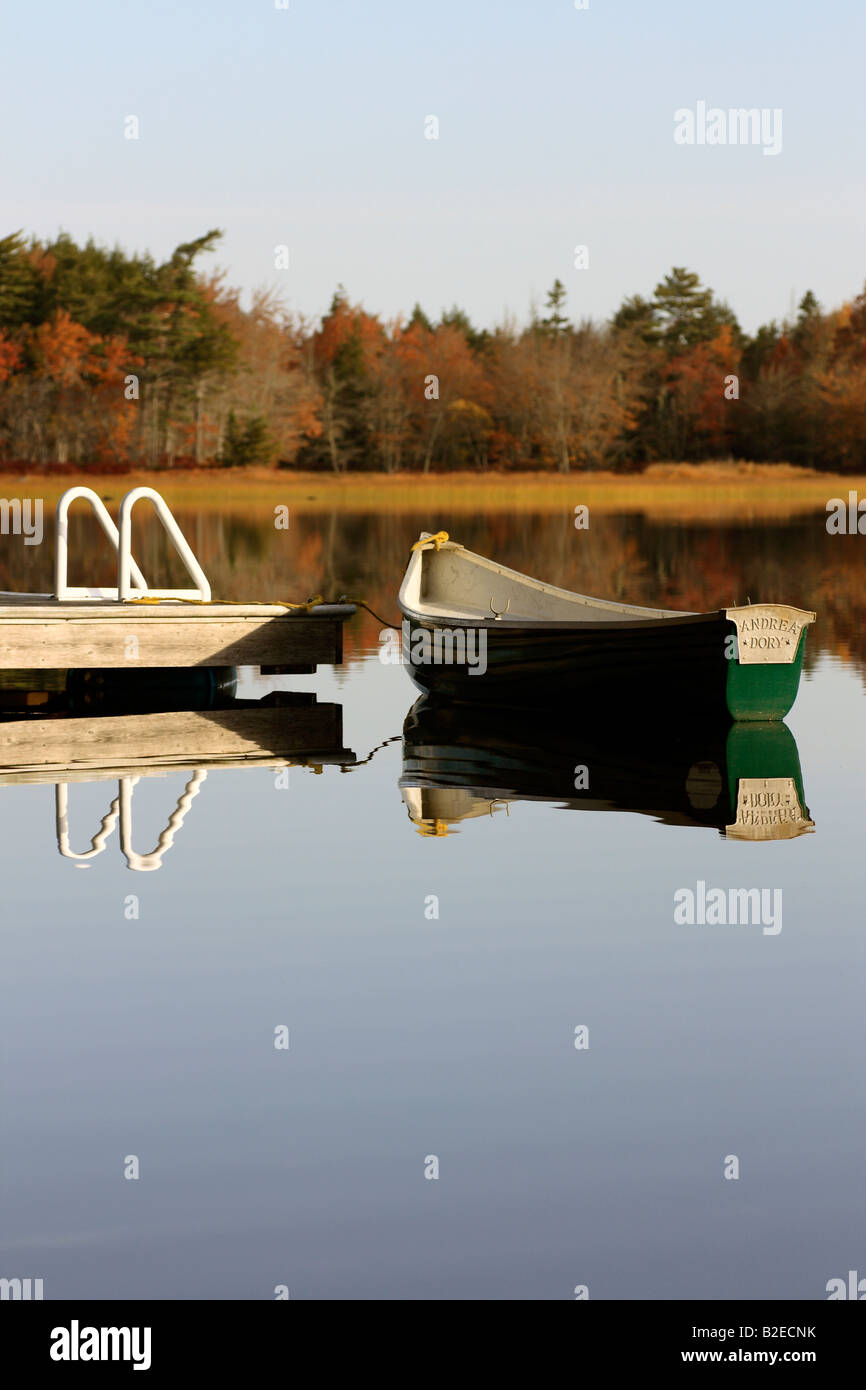 an autumn scenic with a wharf and rowboat at Ponhook Lake in nova ...