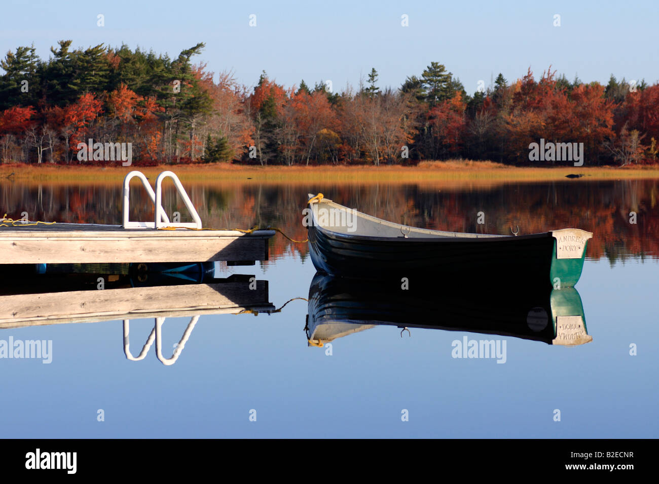 an autumn scenic with a wharf and rowboat at Ponhook Lake in nova ...