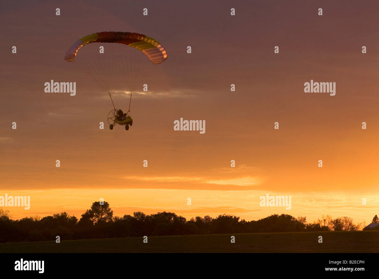 Powered parachute flying at sunset in Eaton County Michigan Stock Photo ...
