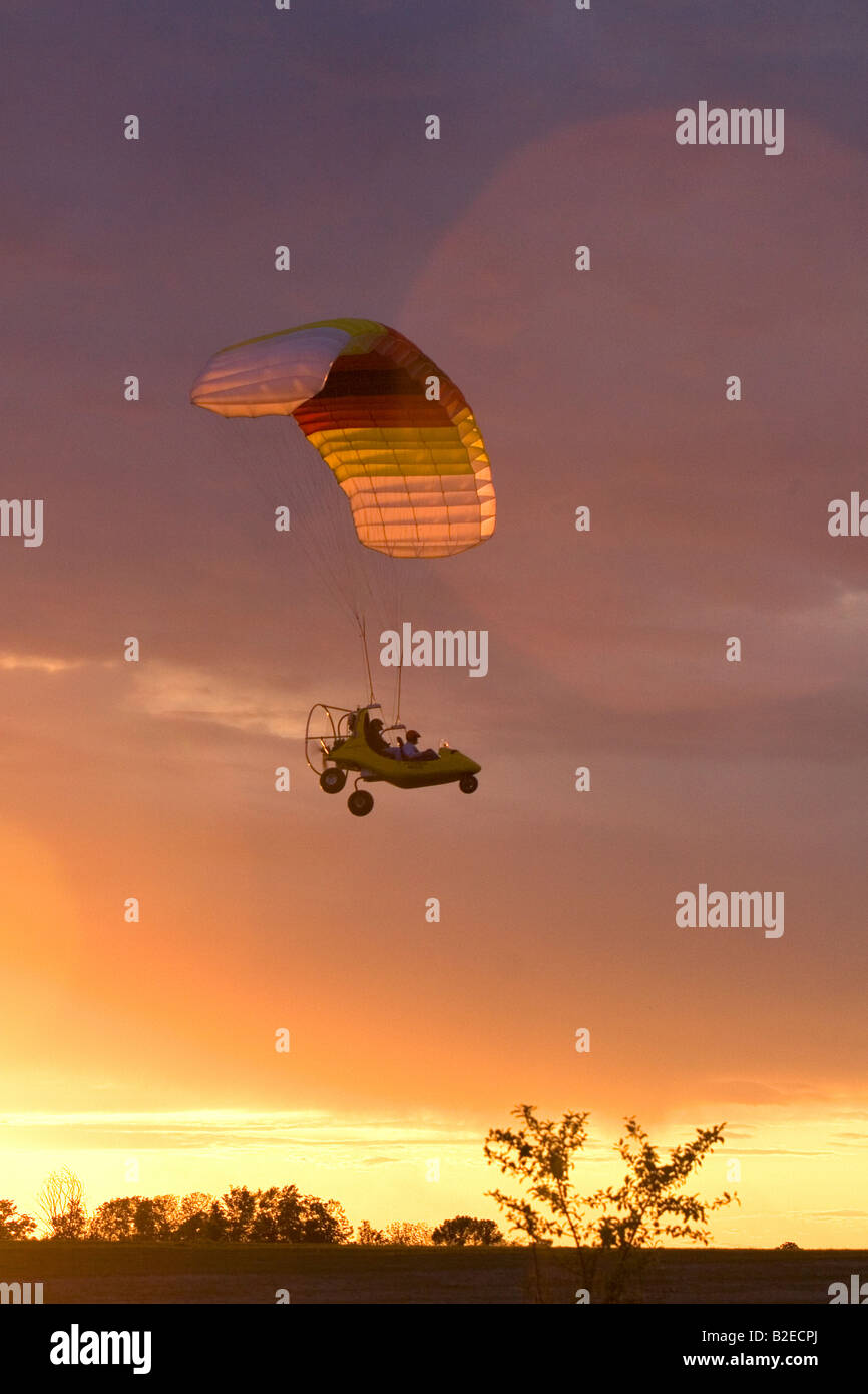 Powered parachute flying at sunset in Eaton County Michigan Stock Photo ...