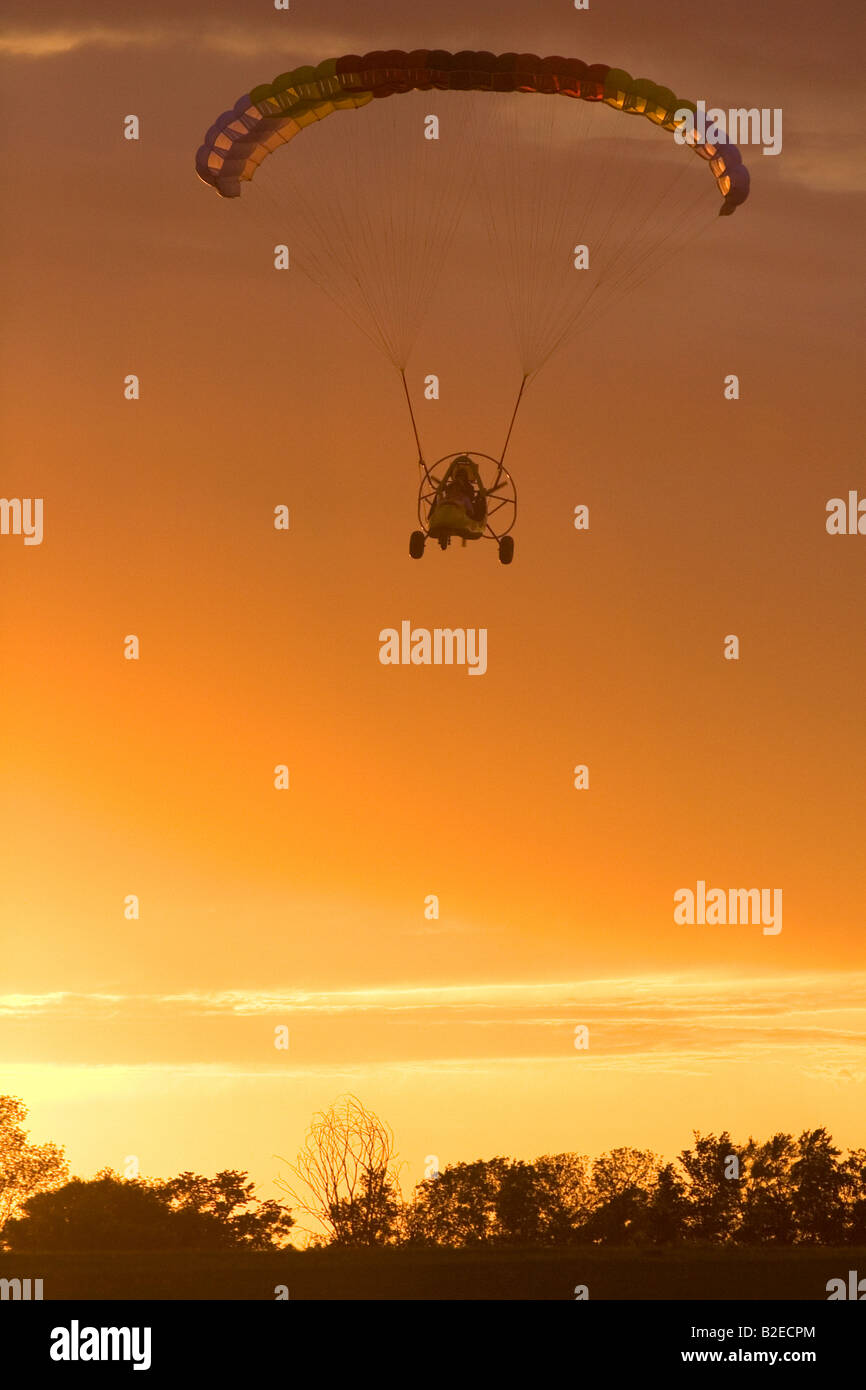 Powered parachute flying at sunset in Eaton County Michigan Stock Photo ...