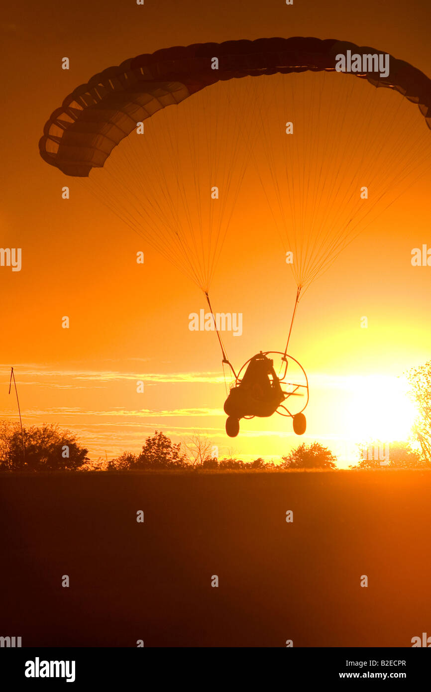 Powered parachute flying at sunset in Eation County Michigan Stock ...