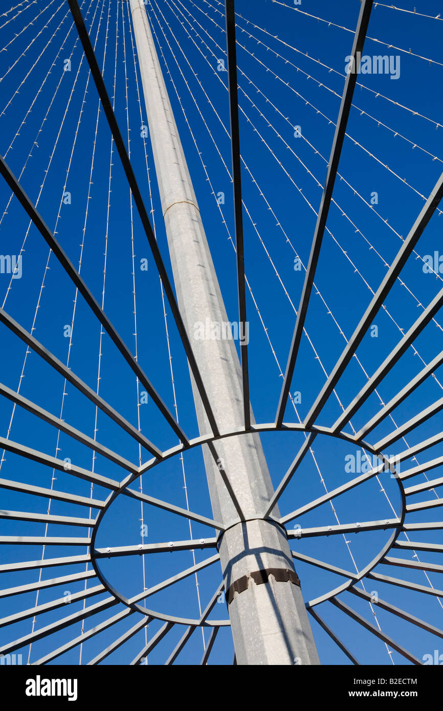 Tension supports for wires coming from top of high metal light pole ...