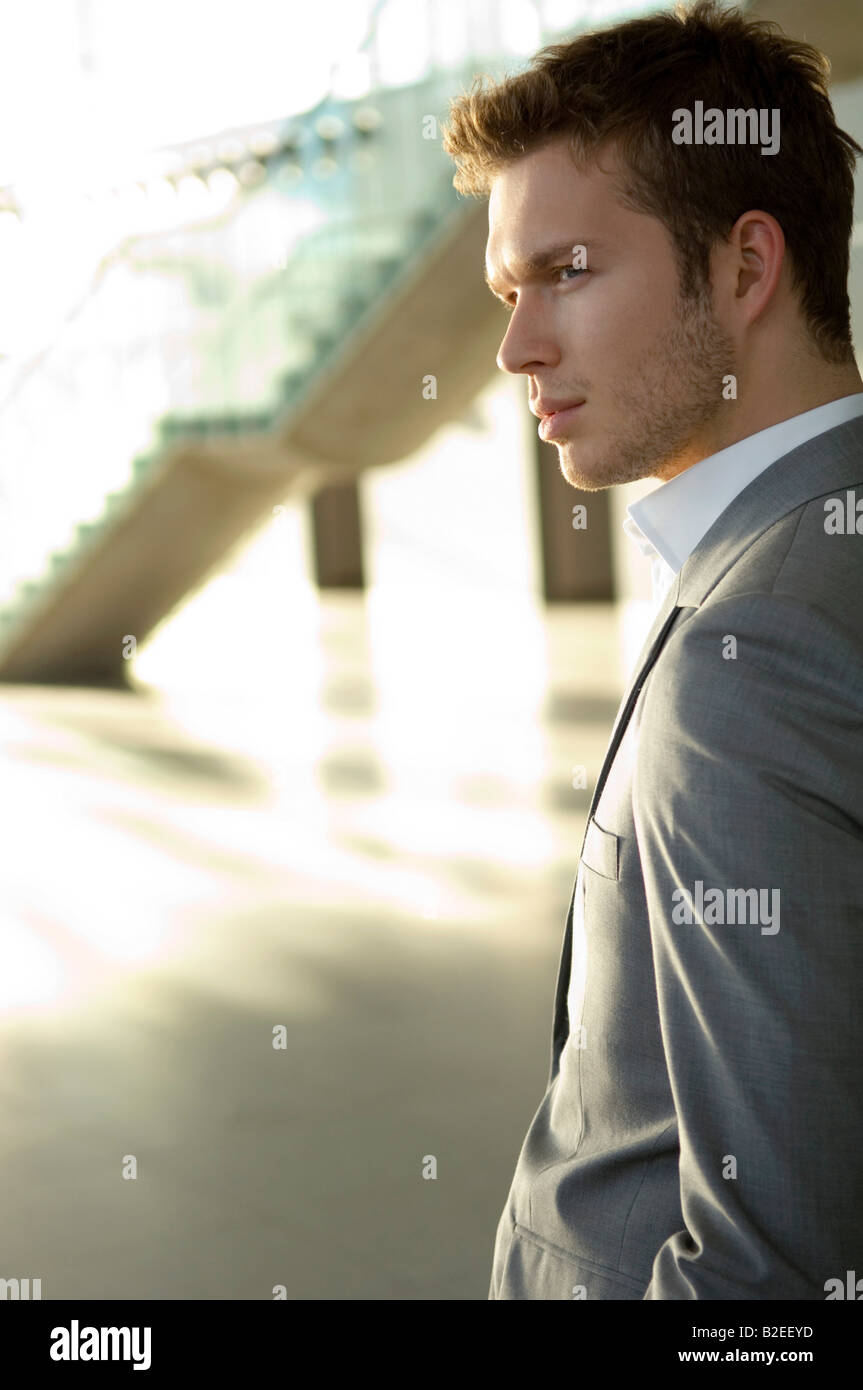 Businessman standing in an office Stock Photo - Alamy
