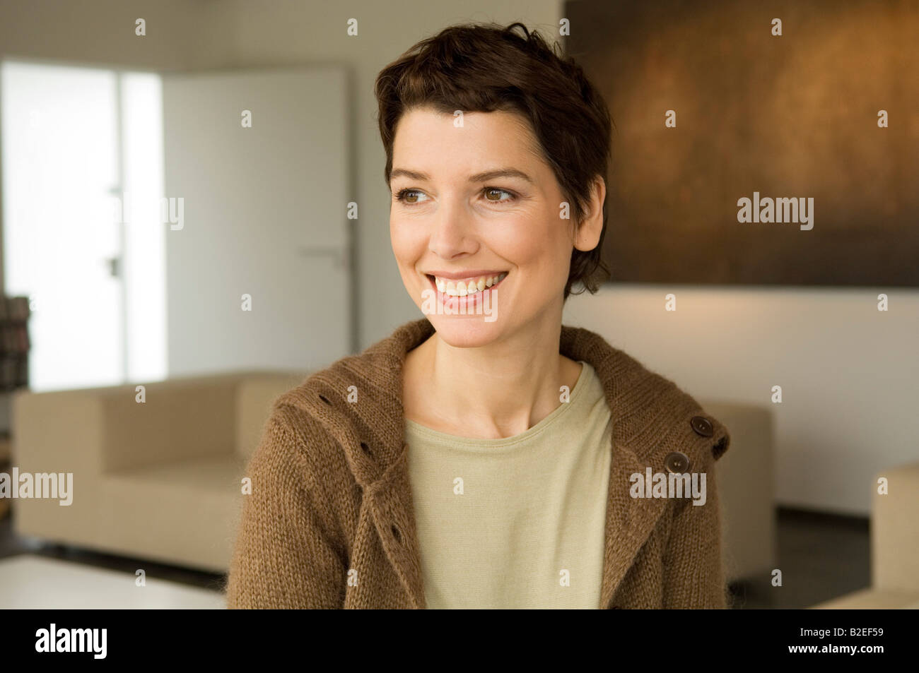 Mid adult woman smiling Stock Photo - Alamy