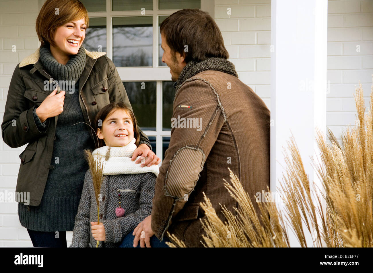 Girl talking with her parents Stock Photo - Alamy
