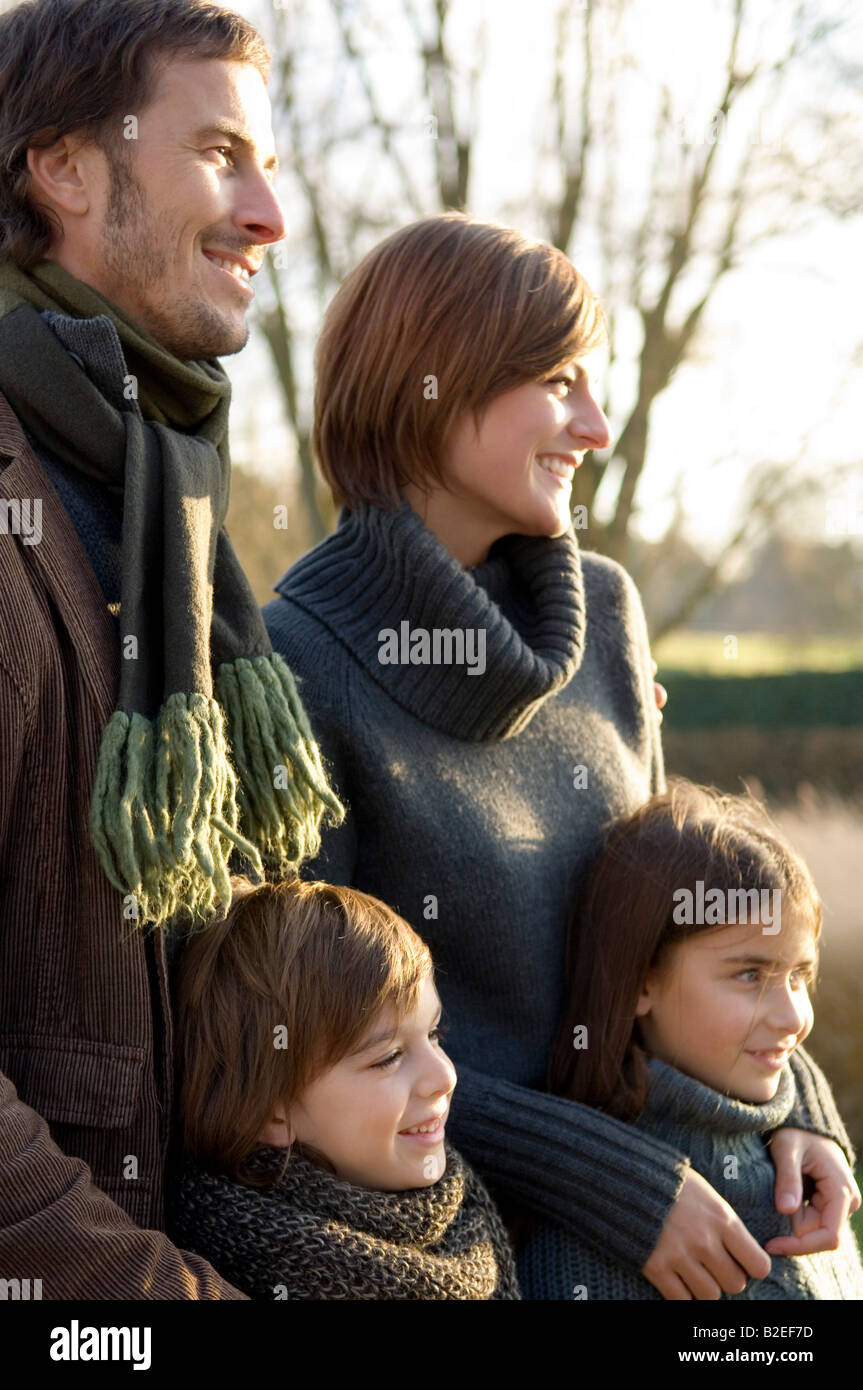Two children smiling with their parents Stock Photo - Alamy