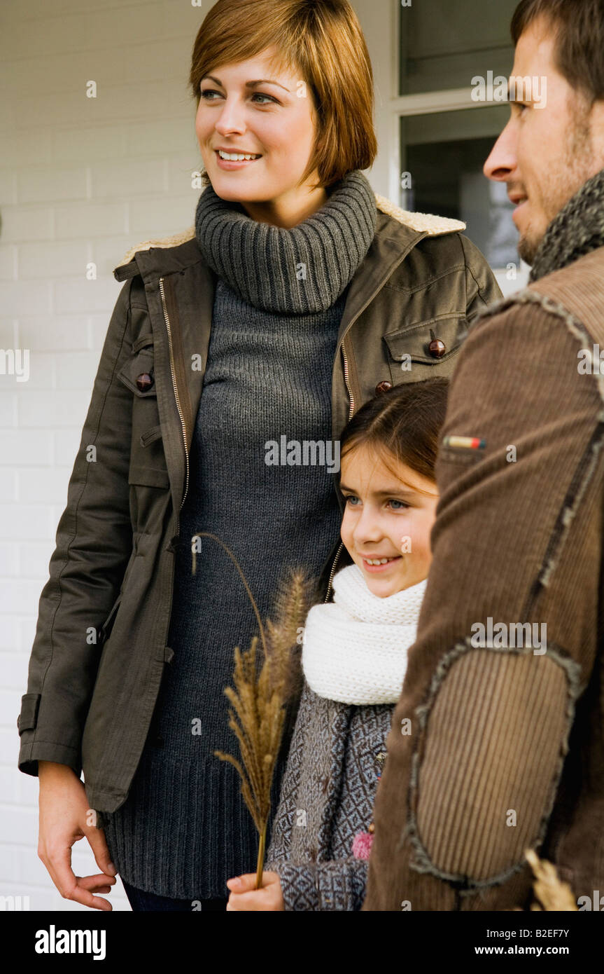 Girl with her parents smiling Stock Photo - Alamy