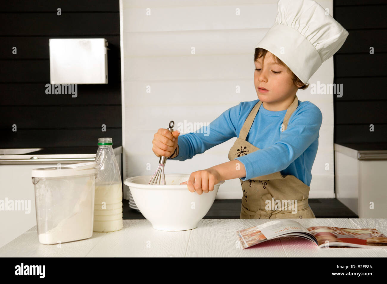 Boy making a cake Stock Photo - Alamy