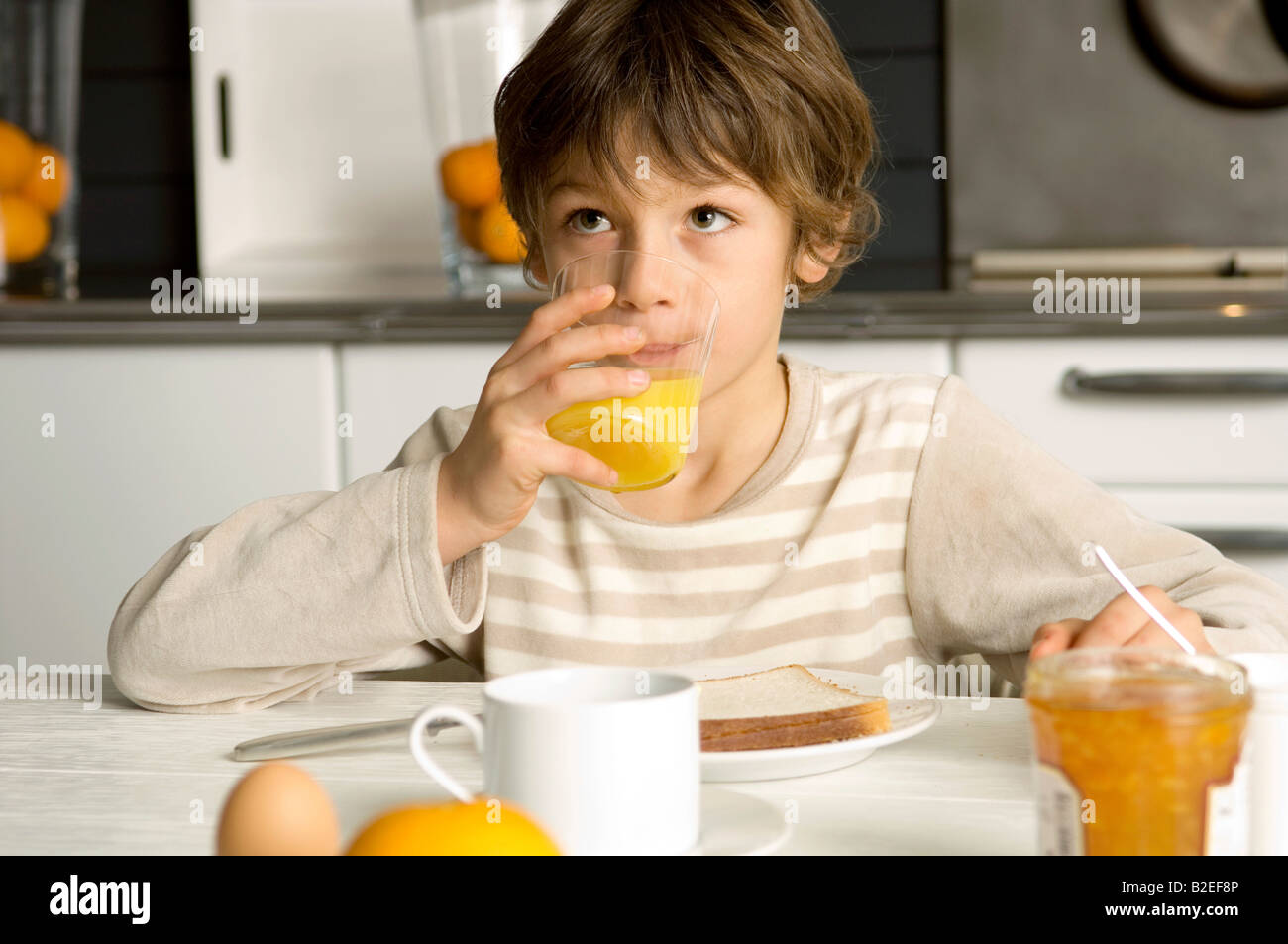 Boy having breakfast Stock Photo - Alamy
