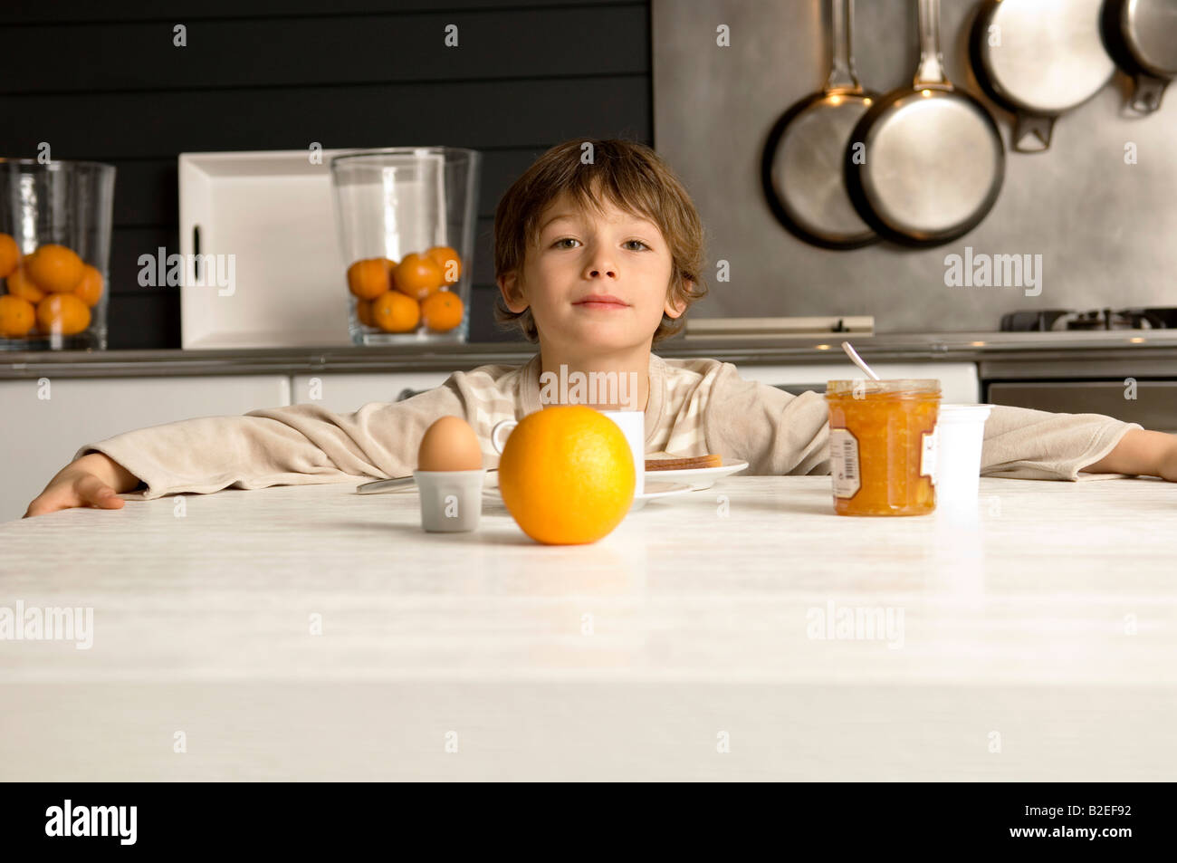 Portrait of a boy having breakfast Stock Photo - Alamy